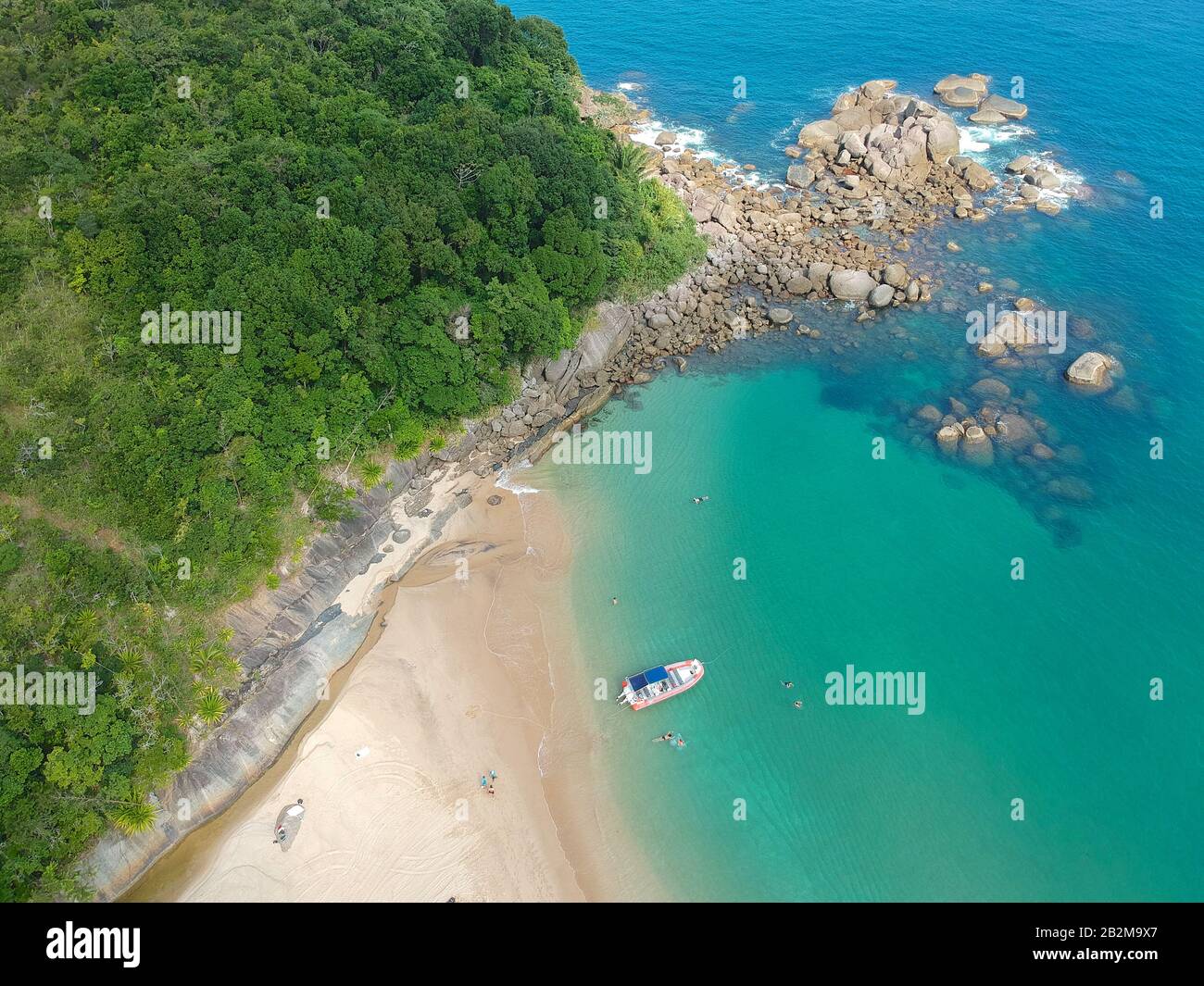 Aerial view of white sandy beach with turquoise water in tropical ...