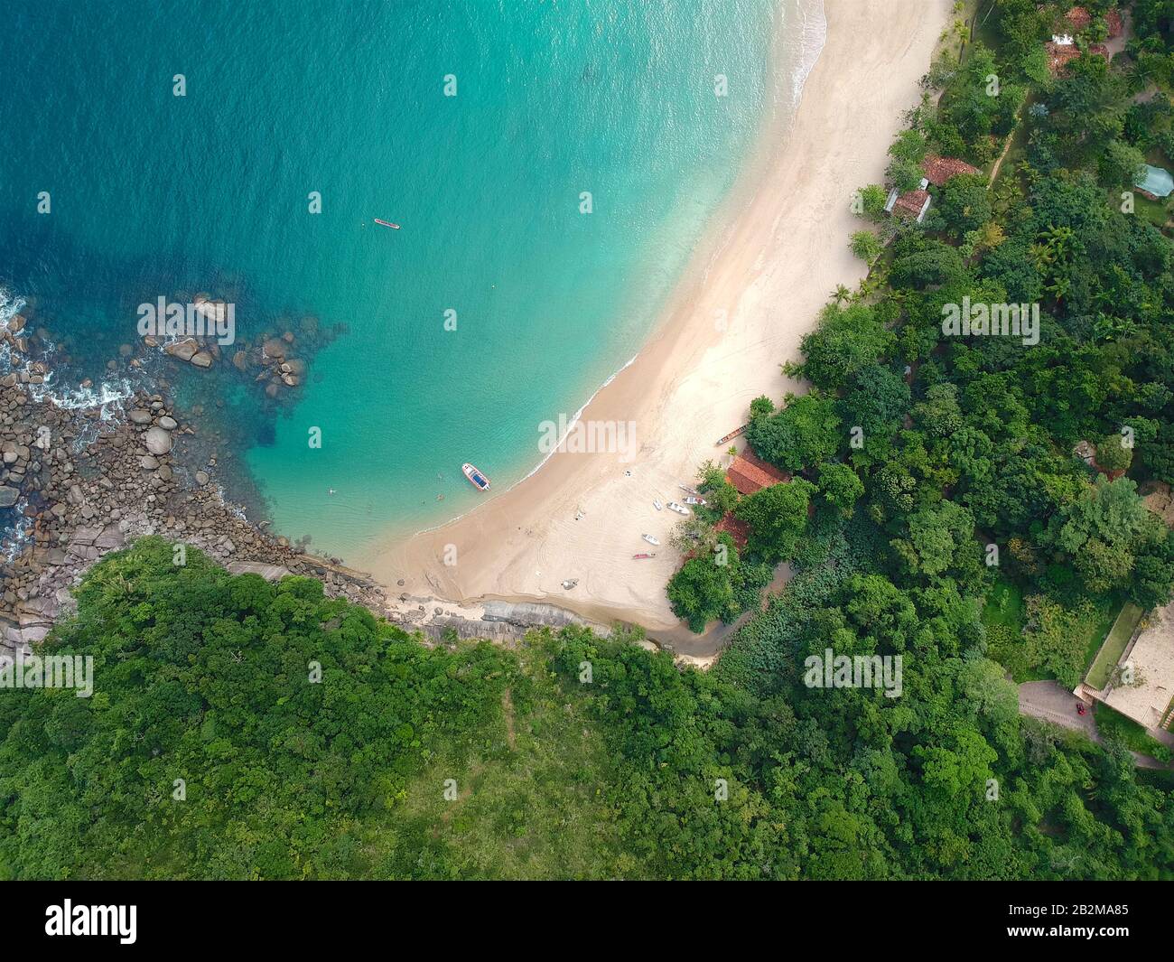 Aerial view of white sandy beach with turquoise water in tropical ...