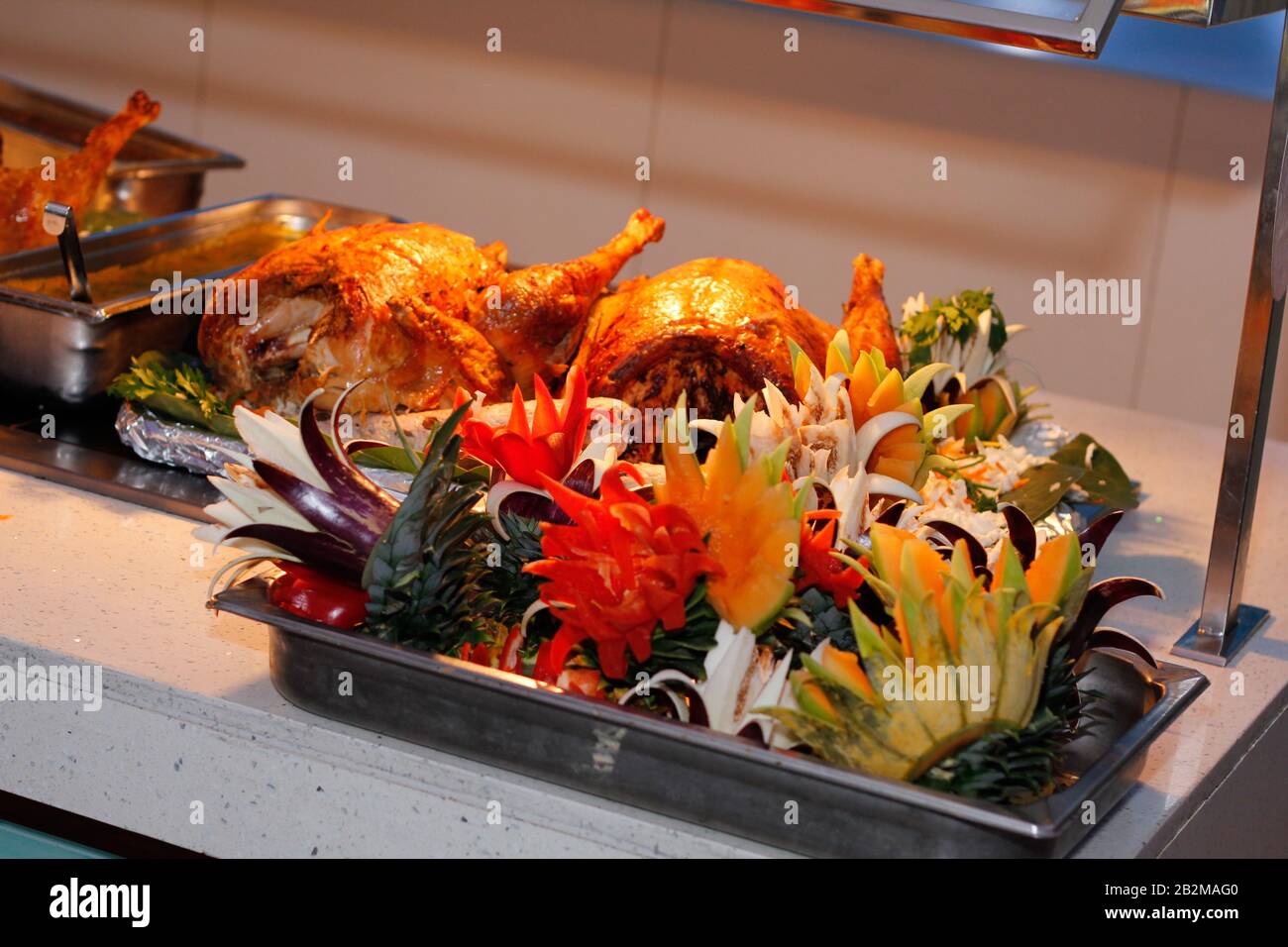 Trays full of roasted chickens served at the buffet Stock Photo - Alamy