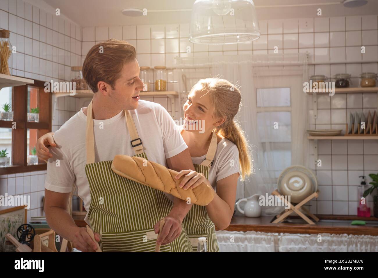 Portrait of cheerful positive caucasian young partners using ...