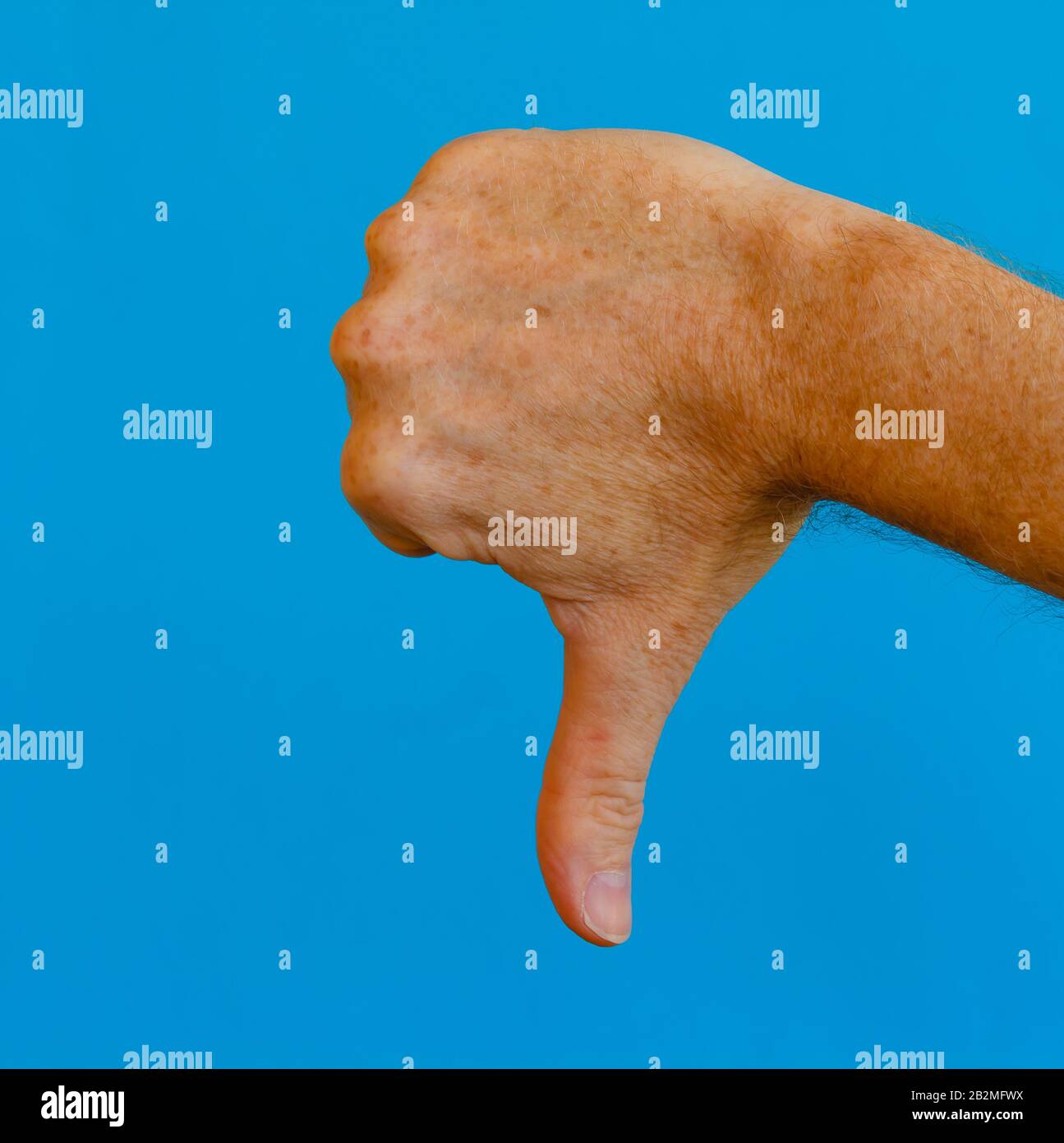 the gesture of the hand of the inverted thumb to express the meaning of ...