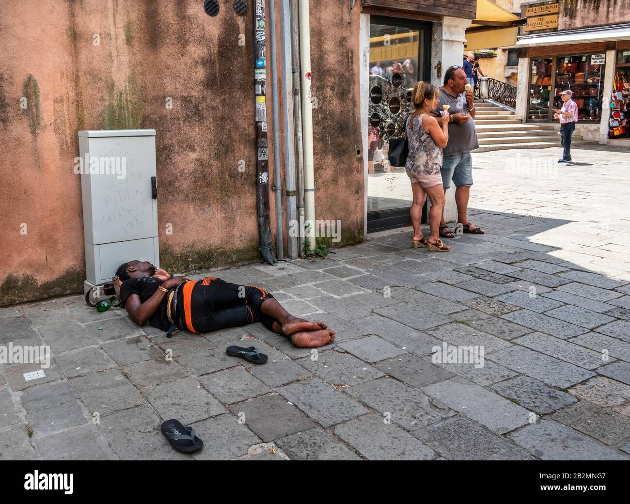 African homeless sleeping street hi-res stock photography and images ...