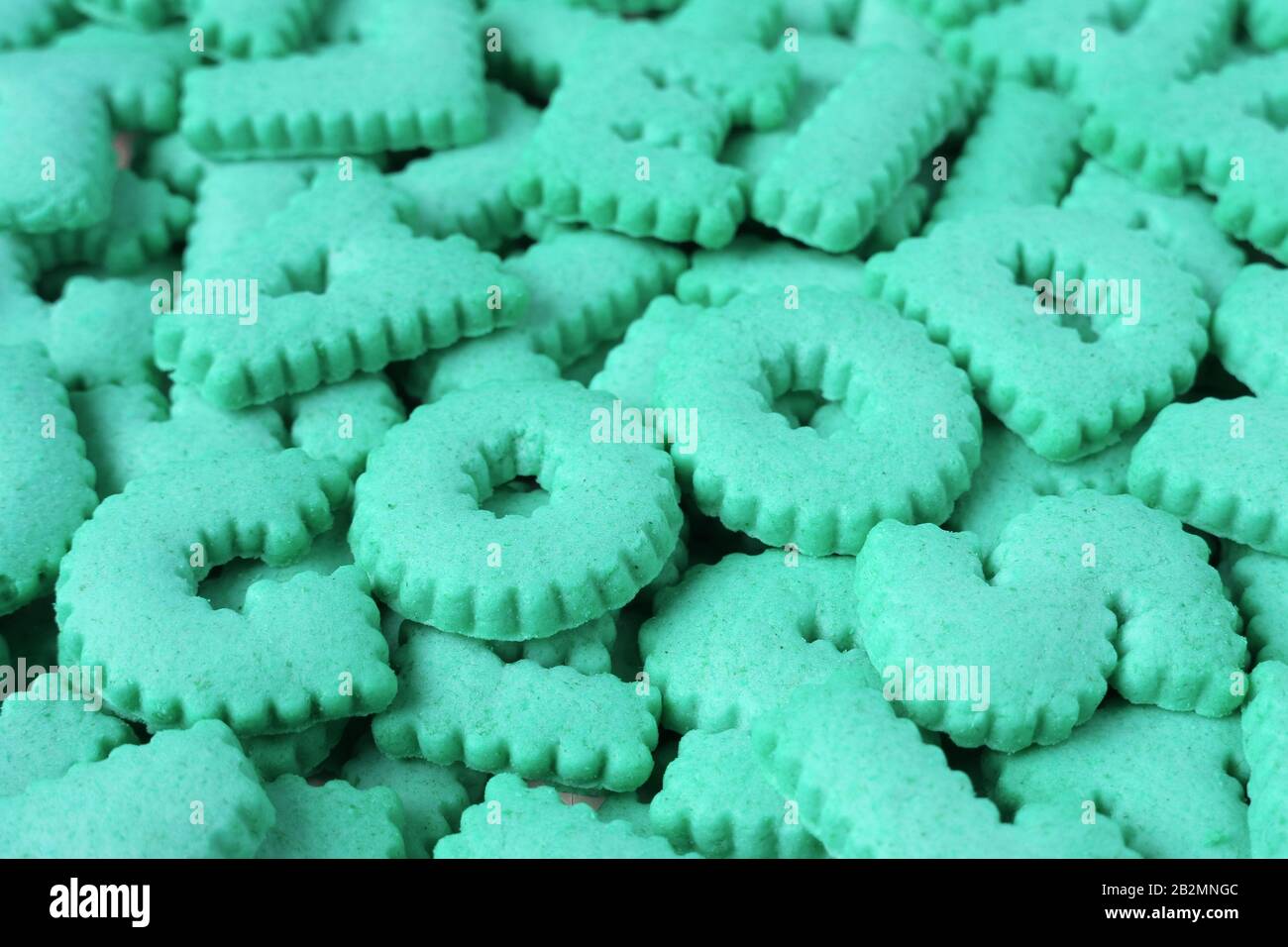 Closeup aqua blue alphabet cookies spelling the word GOOD on cookies ...