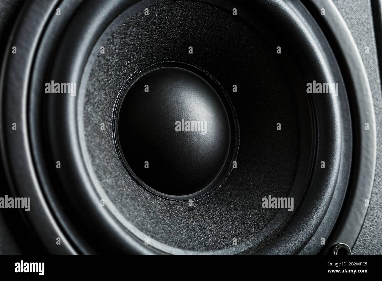 Multimedia speaker system speaker close-up on a black background. A ...