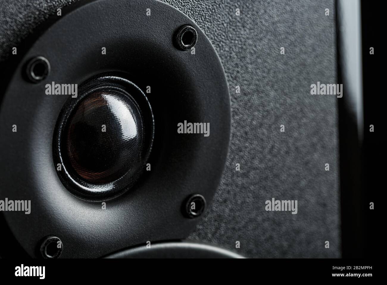 Multimedia speaker system speaker close-up on a black background. A ...