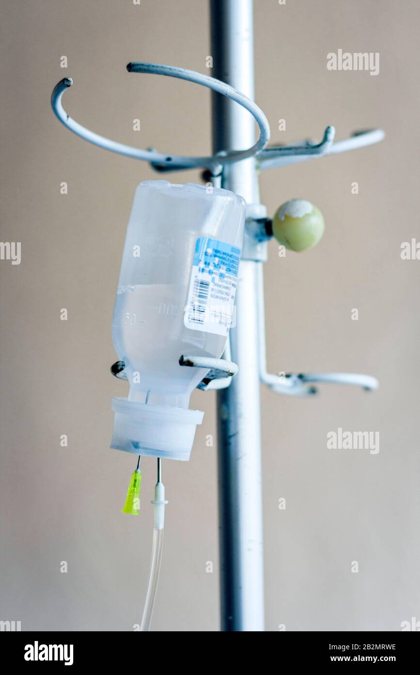 Close-up bottle of medicine on dropper system in the operating room ...