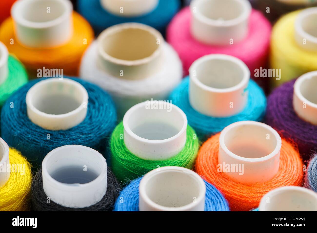 Colorful spools of sewing thread. Colored thread for sewing. Texture ...