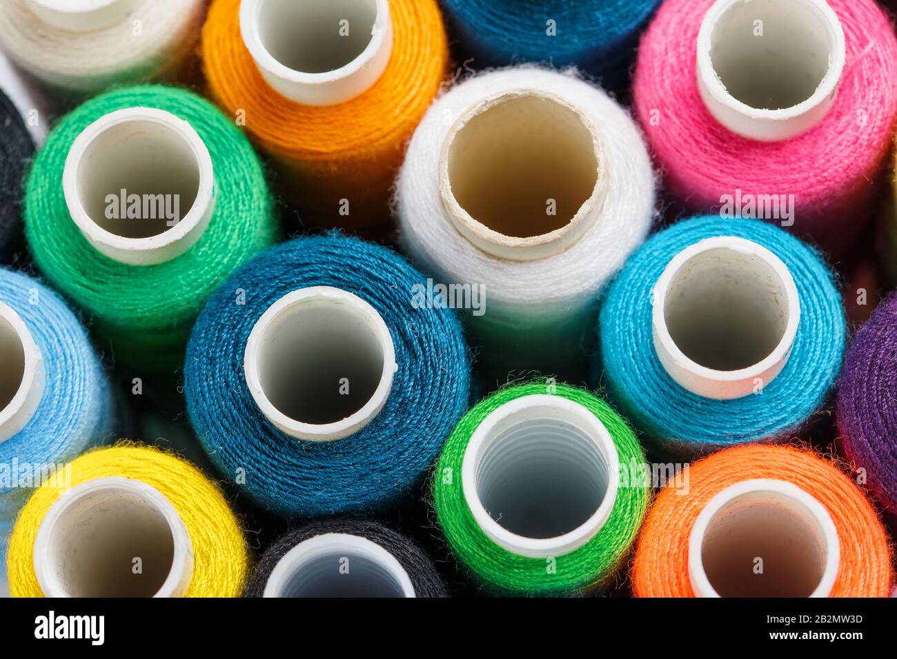 Colorful spools of sewing thread. Colored thread for sewing. Texture ...