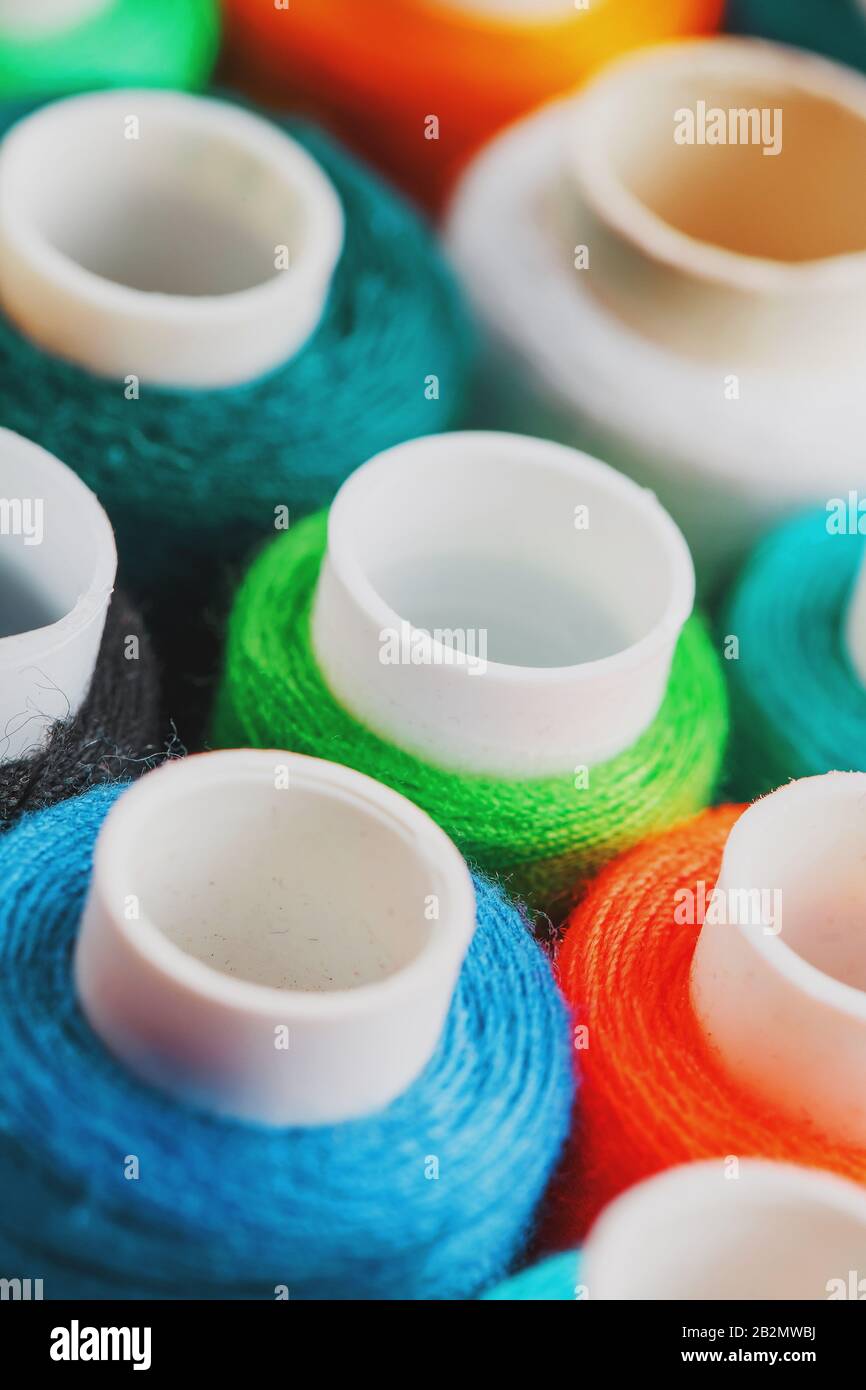 Colorful spools of sewing thread. Colored thread for sewing. Texture ...