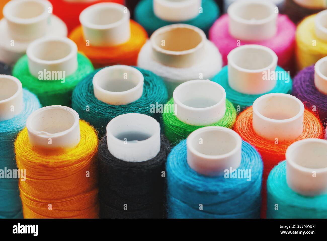 Colorful spools of sewing thread. Colored thread for sewing. Texture ...