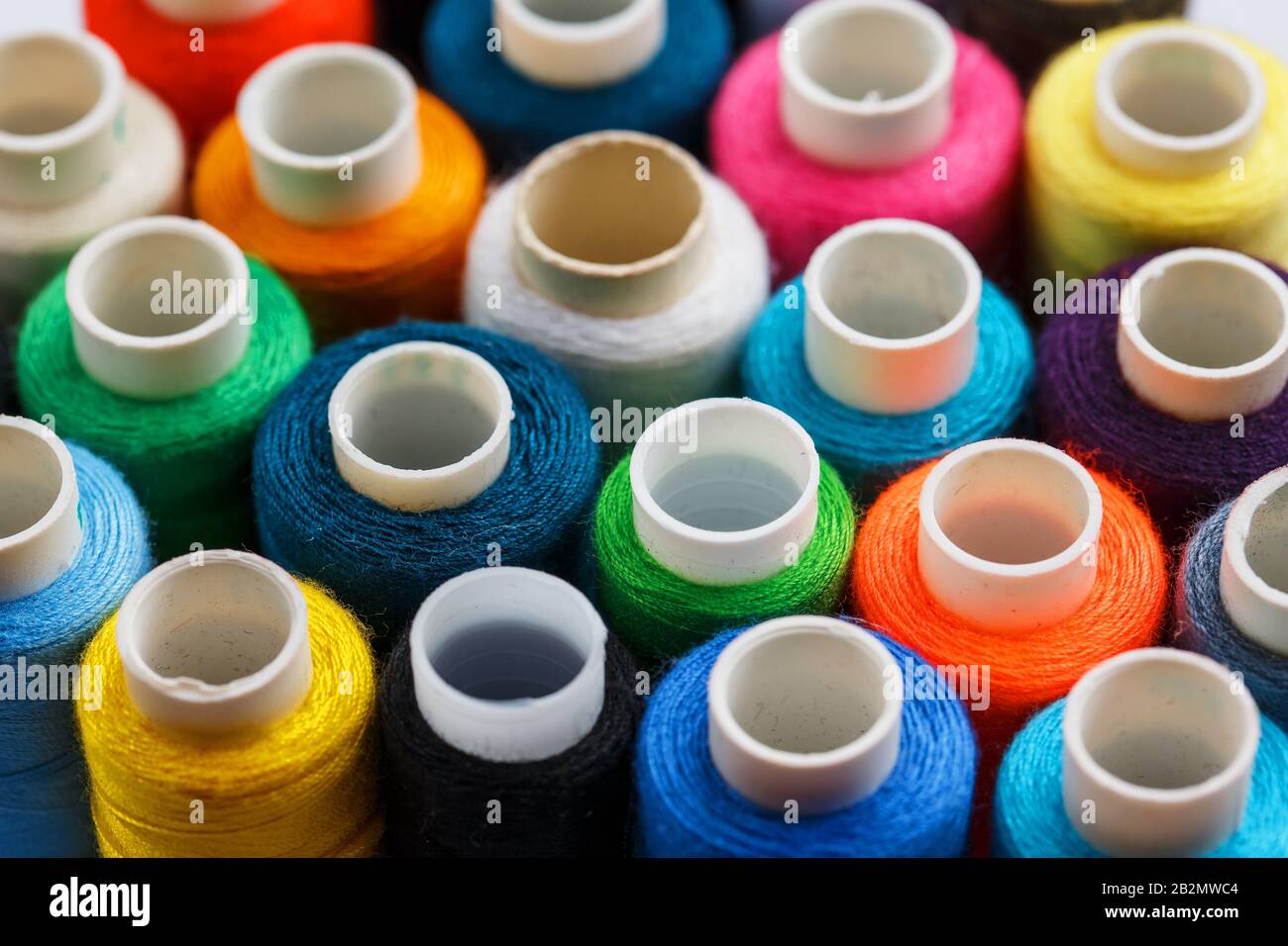 Colorful spools of sewing thread. Colored thread for sewing. Texture ...