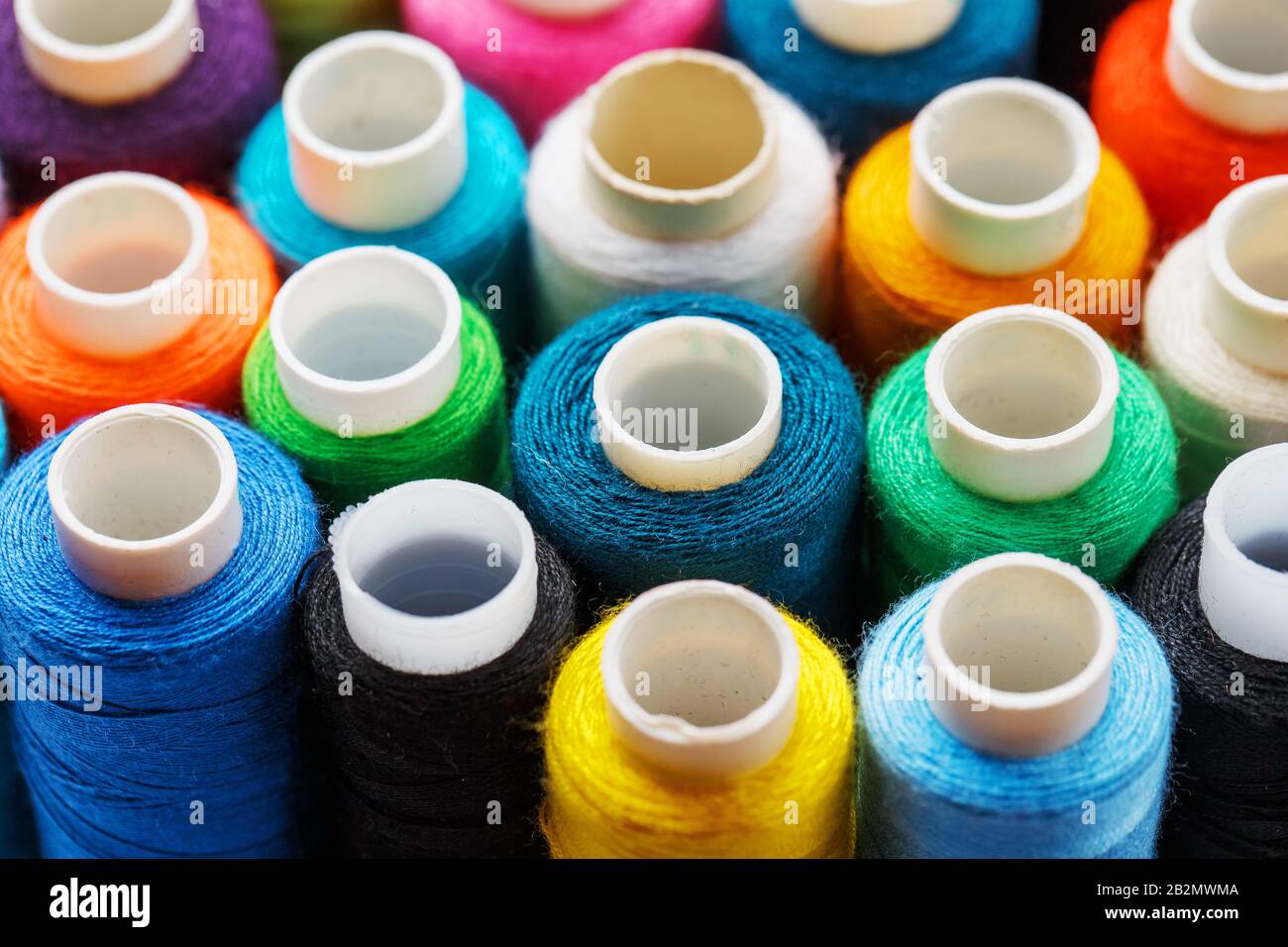 Colorful spools of sewing thread. Colored thread for sewing. Texture ...