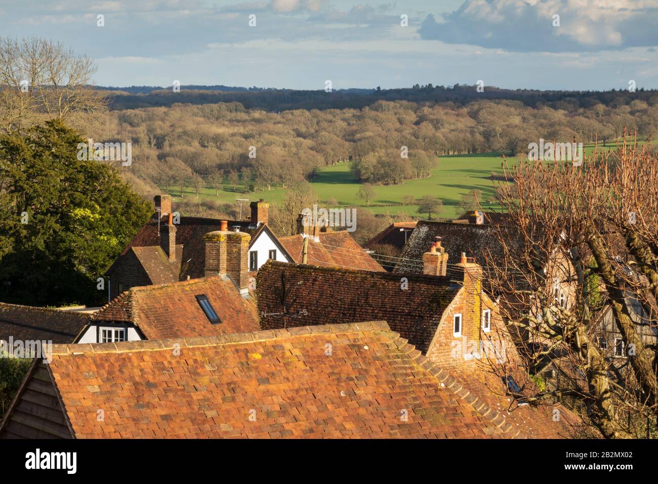 View over cottage rooftops and High Weald landscape in winter, Burwash ...