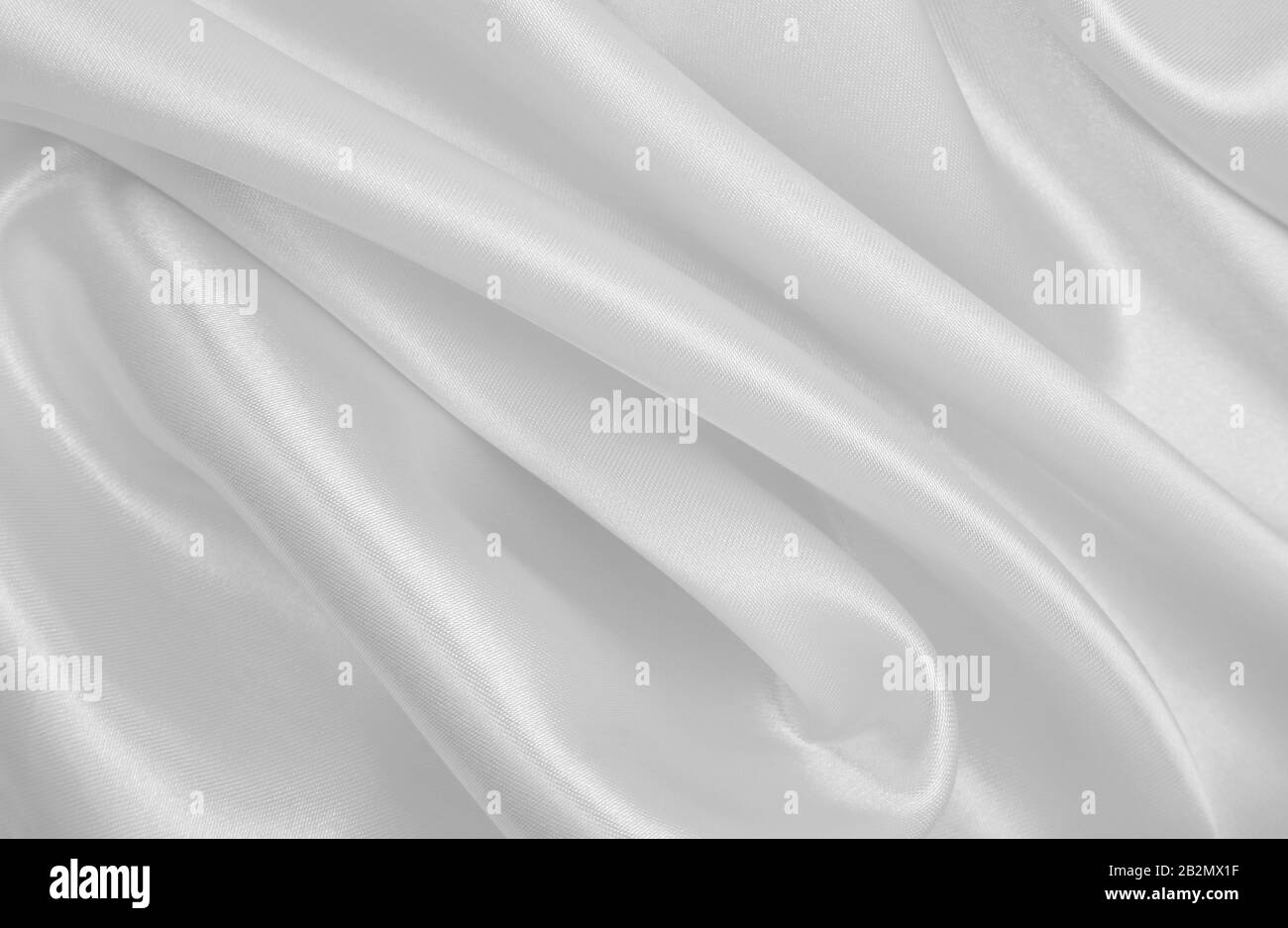 Smooth elegant white silk or satin luxury cloth texture can use as ...