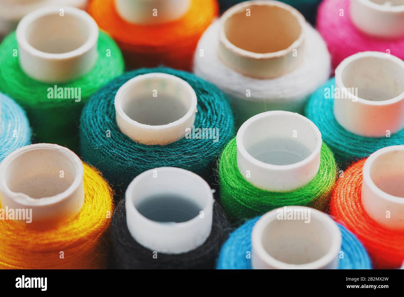 Colorful spools of sewing thread. Colored thread for sewing. Texture ...