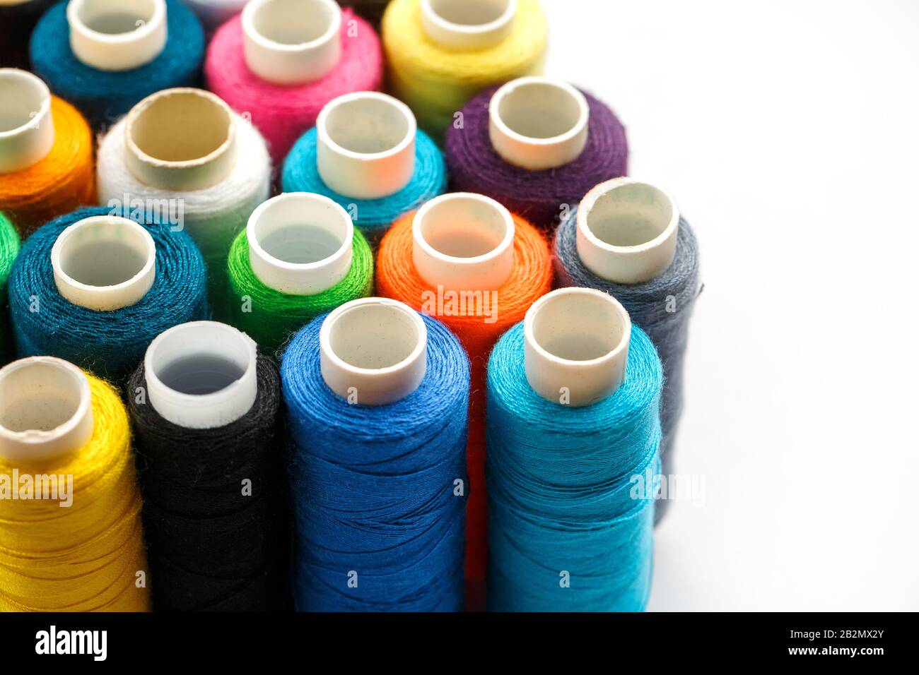 Colorful spools of sewing thread. Colored thread for sewing. Texture ...