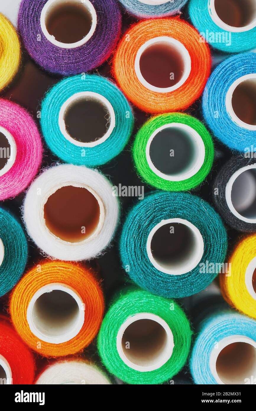 Colorful spools of sewing thread. Colored thread for sewing. Texture ...