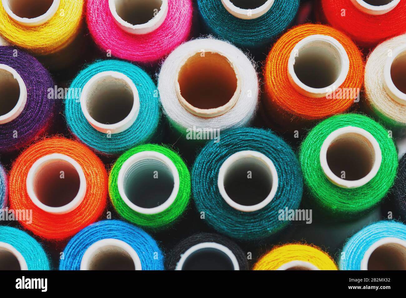 Colorful spools of sewing thread. Colored thread for sewing. Texture ...