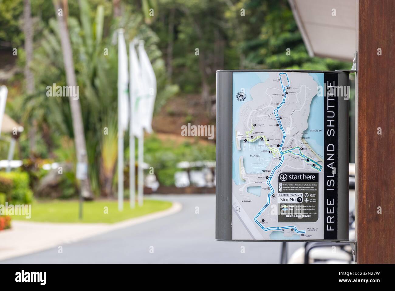 The Free Island Shuttle sing board with a map in Hamilton Island ...