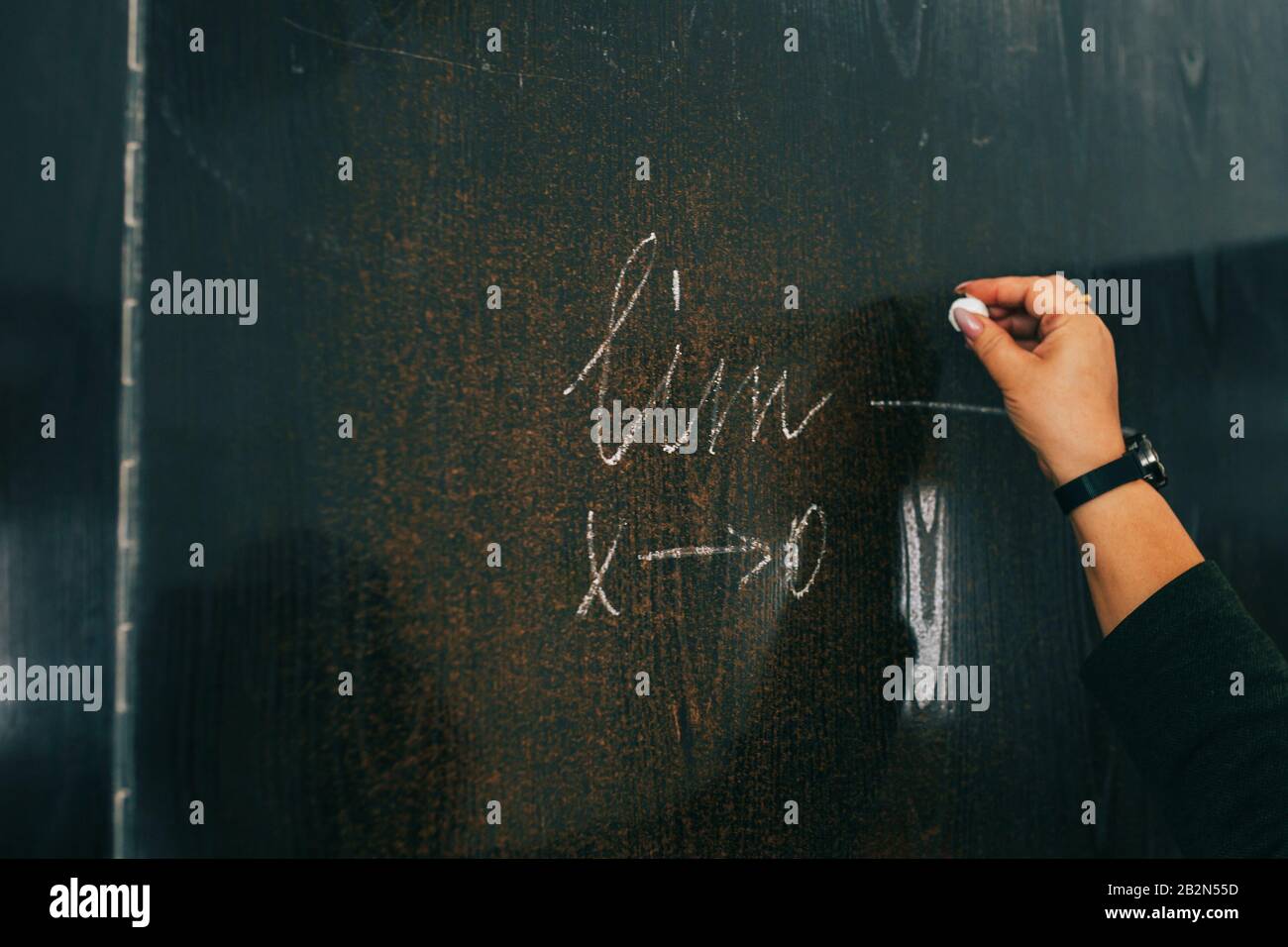 Female teacher writes chalk hi-res stock photography and images - Alamy