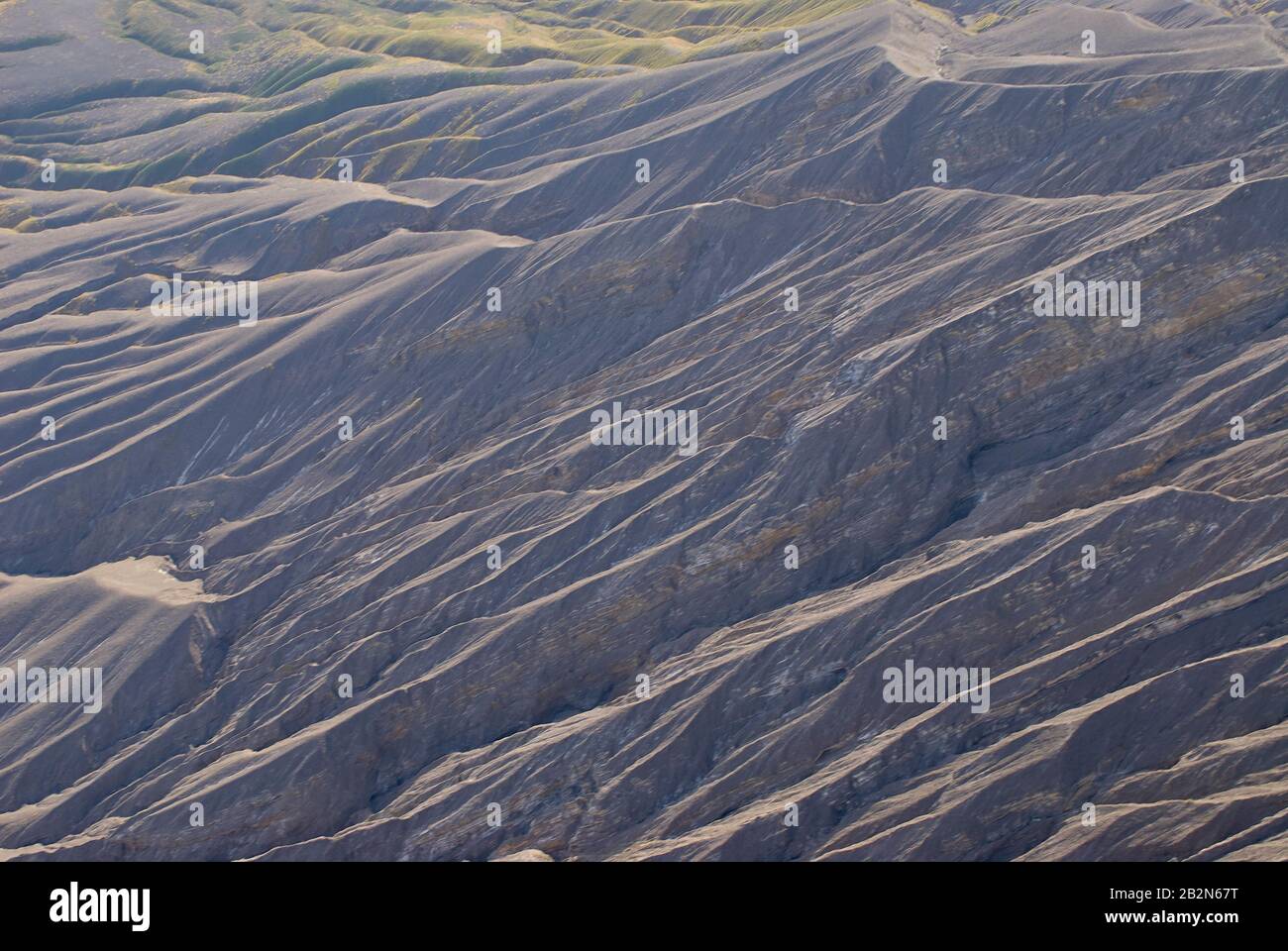 The slopes of the volcano Oldoinyo Lengai, showing erosion and various ...