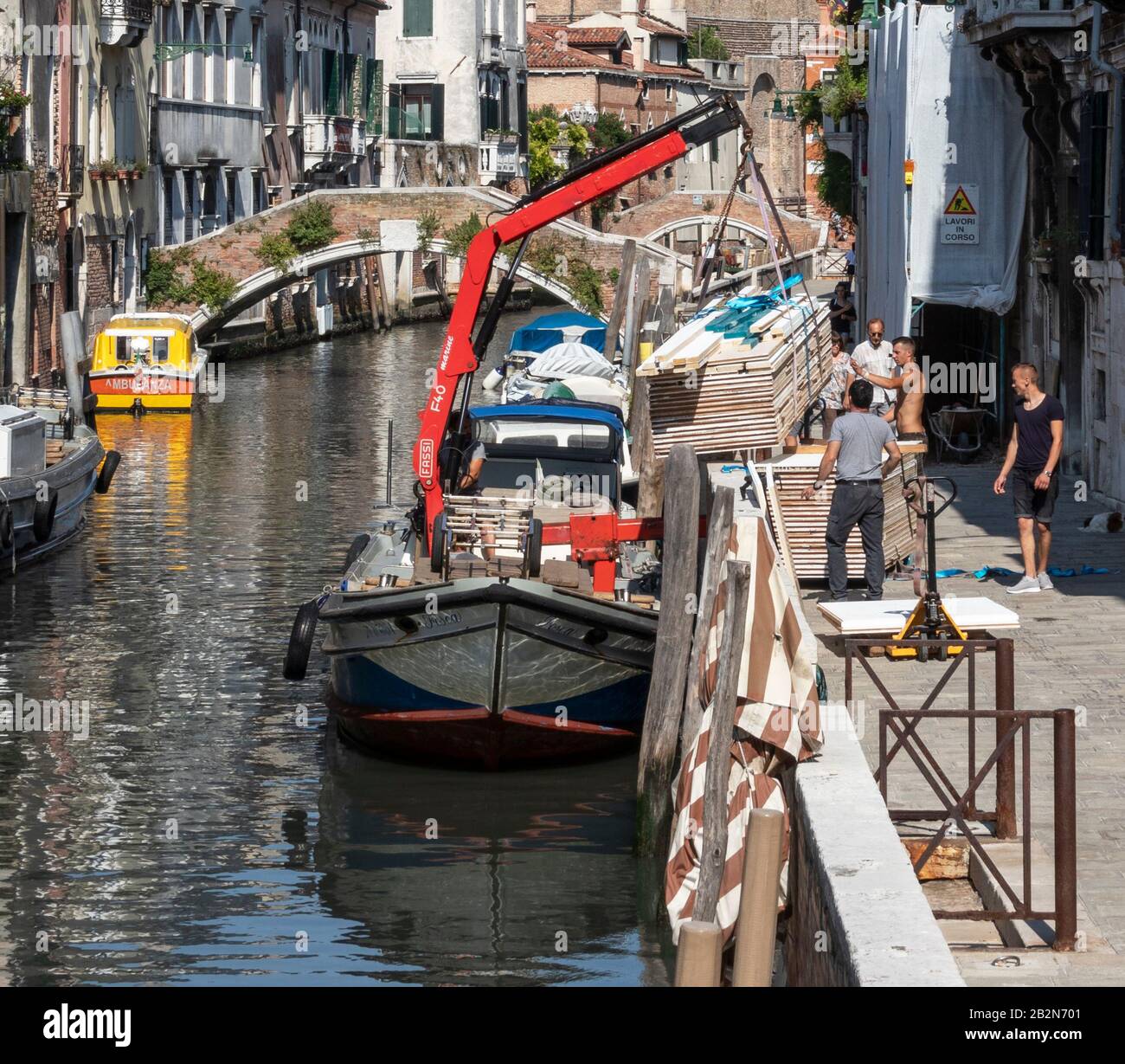 Building materials being delivered by barge, venice, italy Stock Photo ...