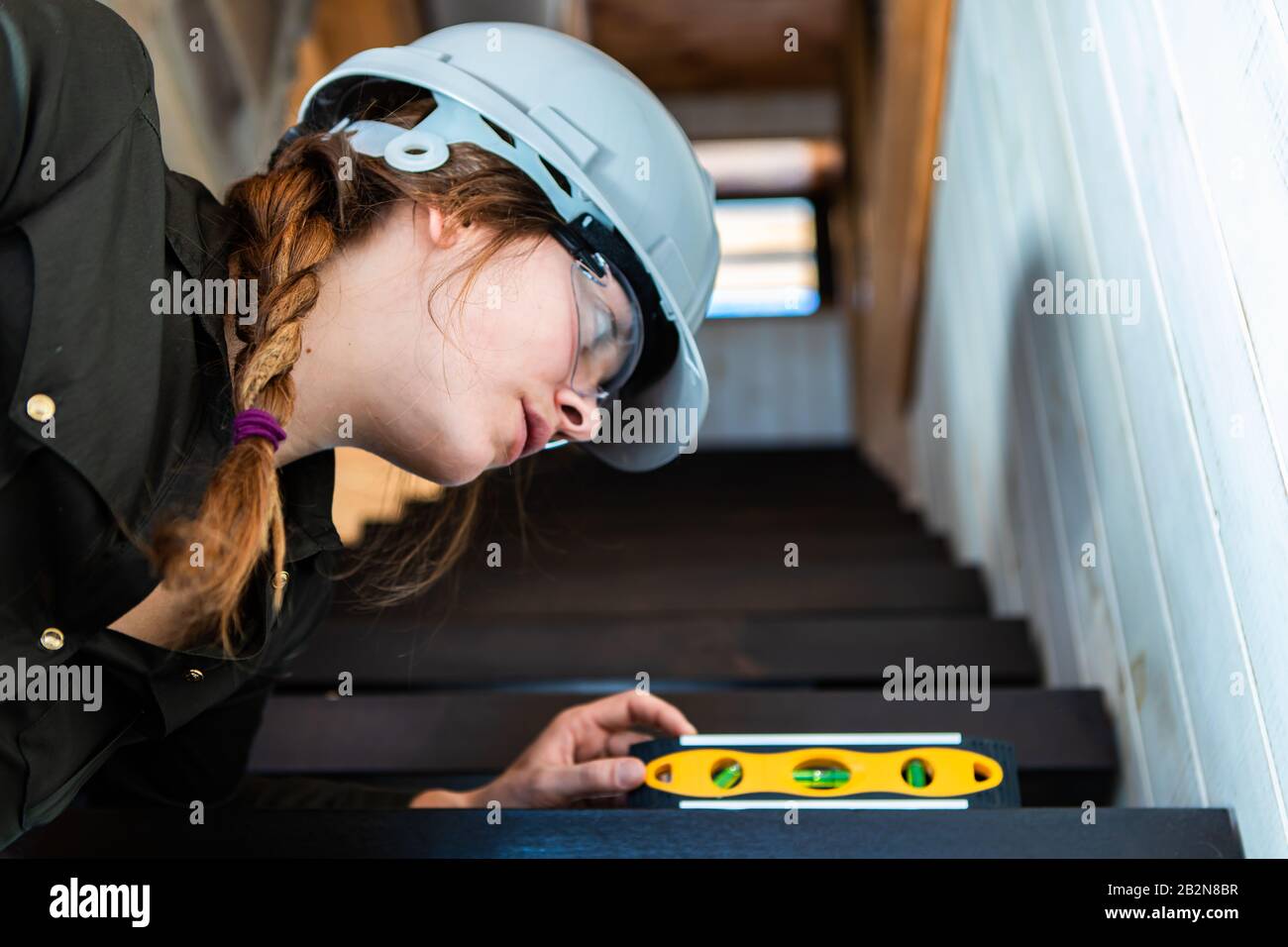 selective focus and close up on women inspector reviews closely a stair ...