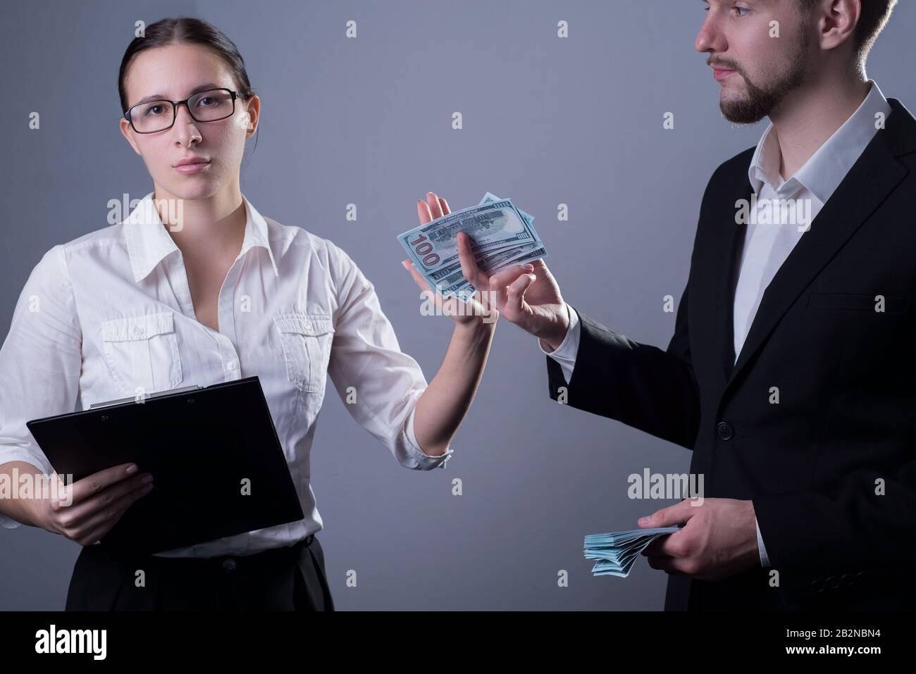 Serious businesswoman refusing to take bribe isolated on white ...
