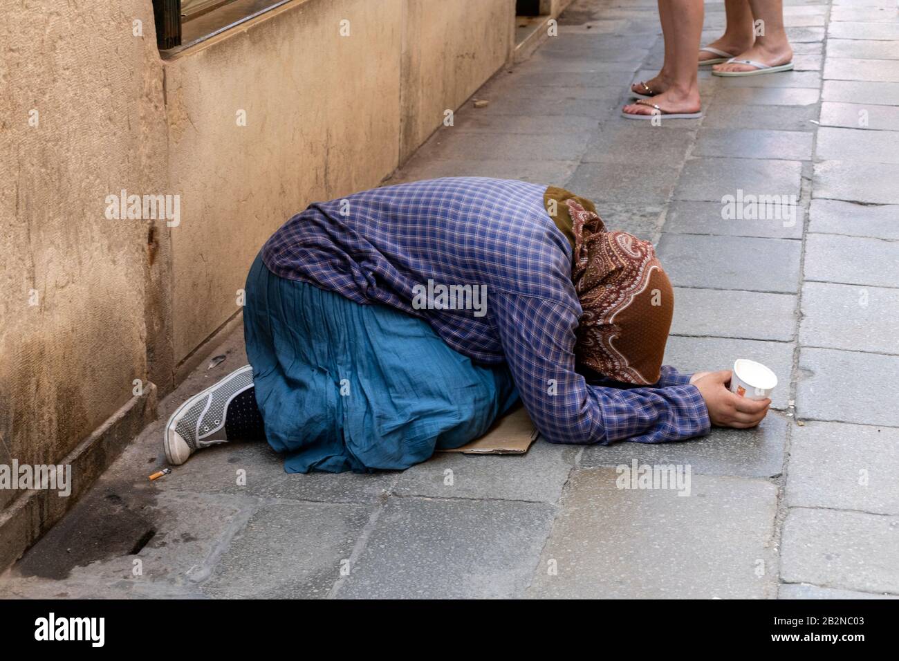 Women Begging High Resolution Stock Photography and Images - Alamy