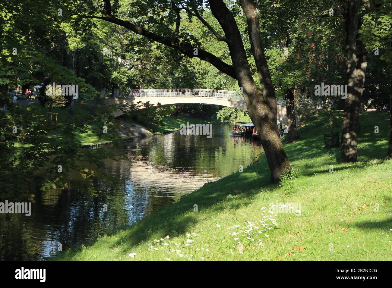 Riga Latvia city center park by the river canal travel with green trees ...