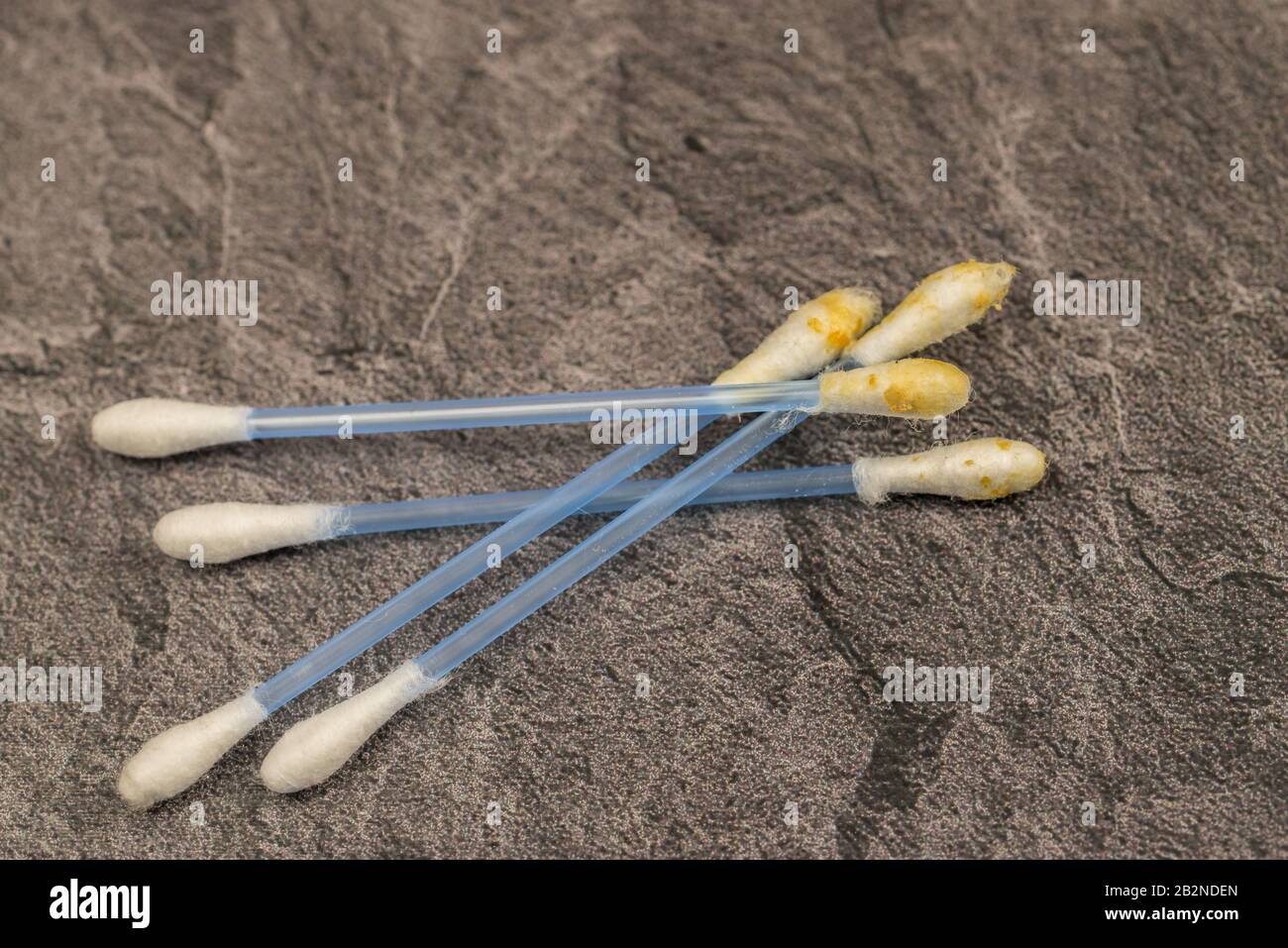 Used blue dirty cotton swabs with earwax, Germany Stock Photo - Alamy