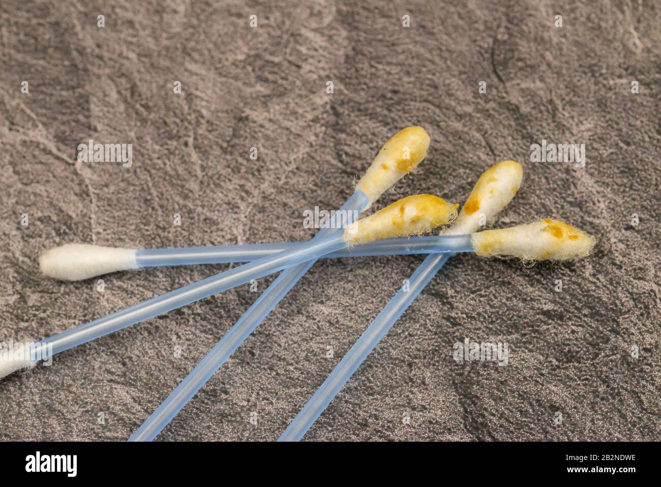 Used blue dirty cotton swabs with earwax, Germany Stock Photo - Alamy
