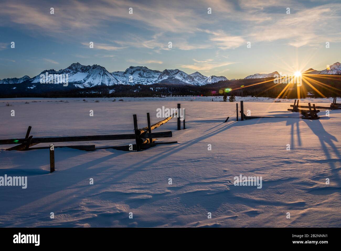 Sawtooth mountain range covered in snow during winter season at sunset ...