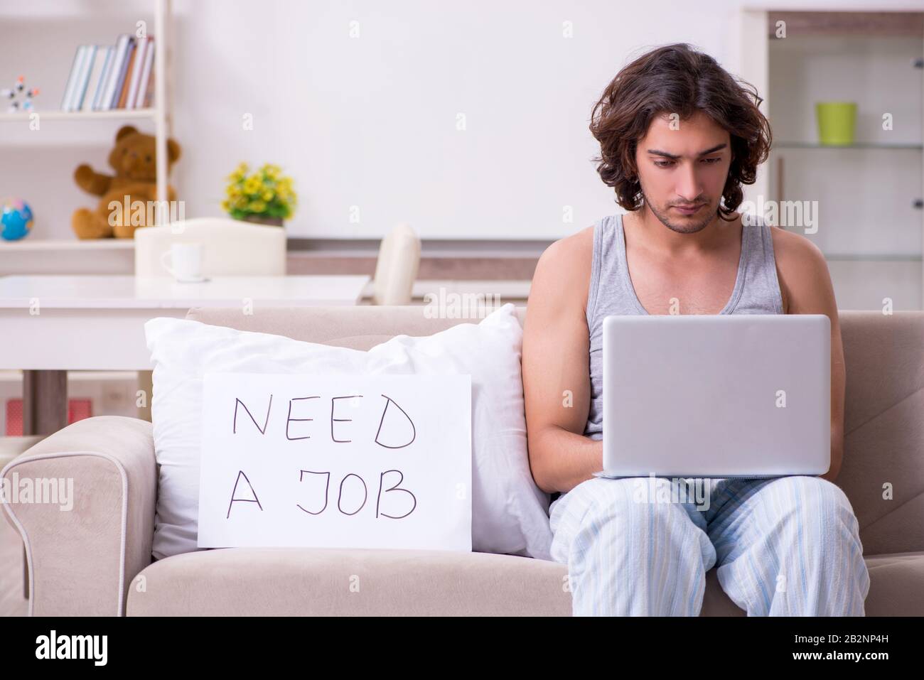 The unemployed man desperate at home Stock Photo - Alamy