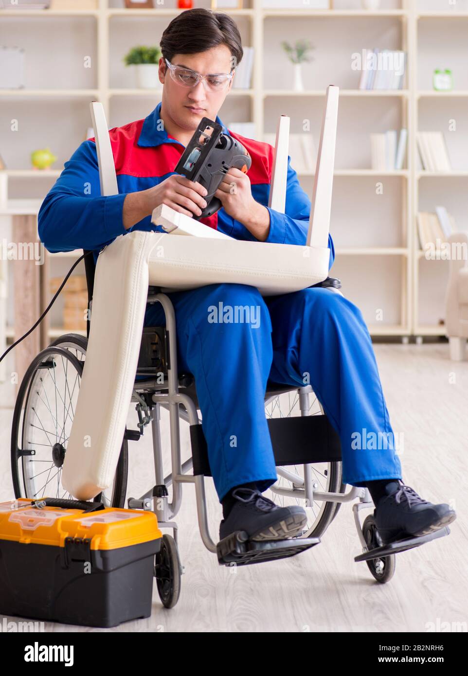 Disabled man assembling furniture hi-res stock photography and images ...