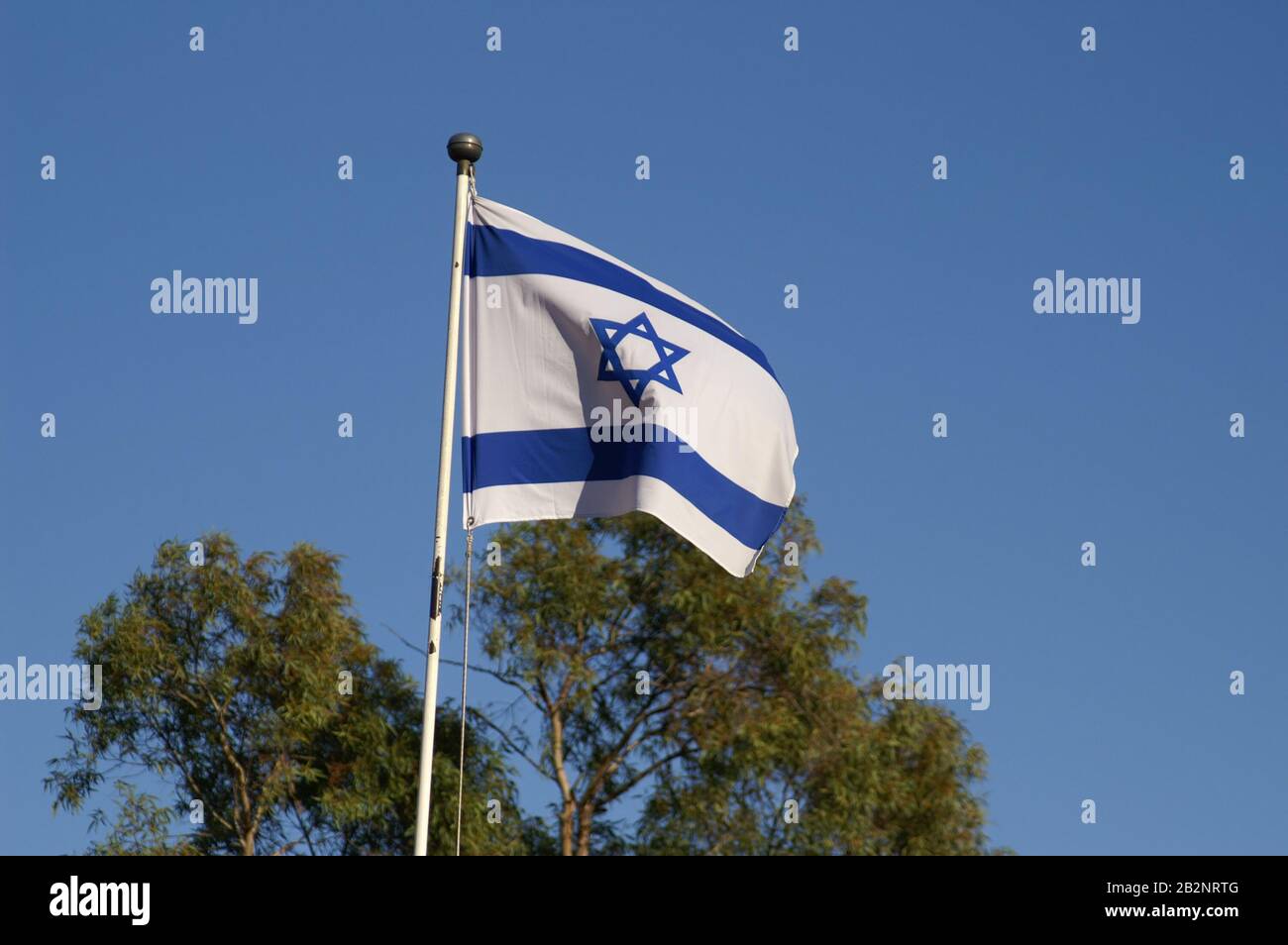 Israel state flag and blue sky - the symbol of glory Stock Photo - Alamy