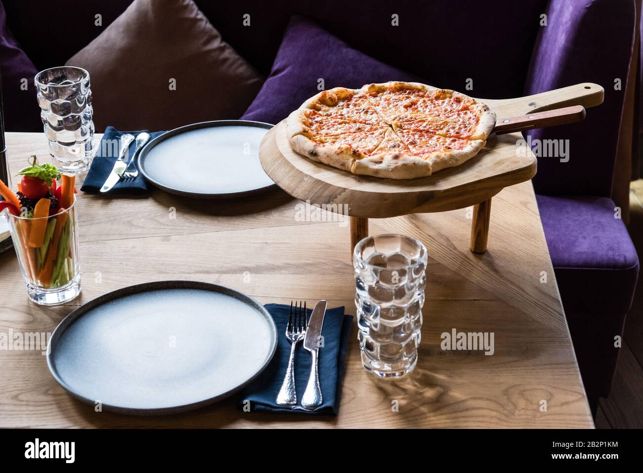 Italian pizza menu classic margarita pizza on the servered table with ...