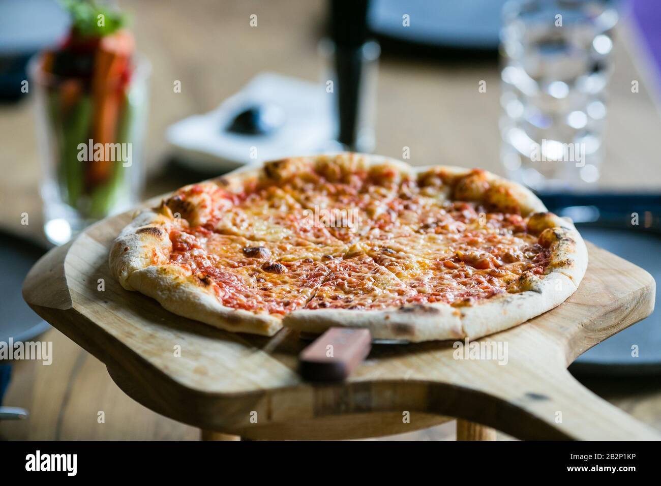 Italian pizza menu classic margarita pizza on the servered table with ...