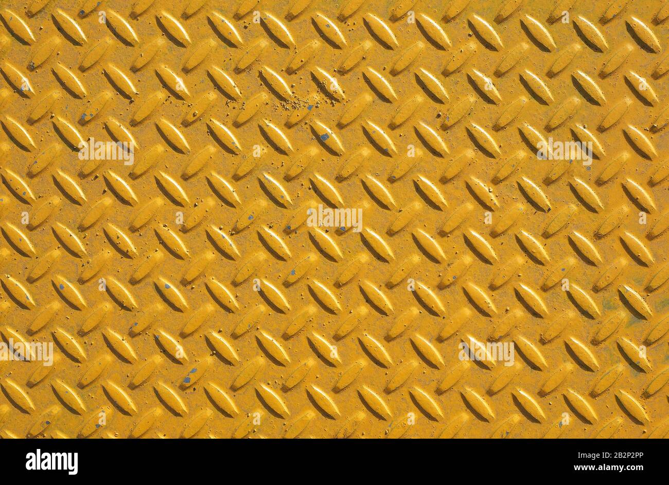 Yellow steel diamond plate useful as a background Stock Photo - Alamy