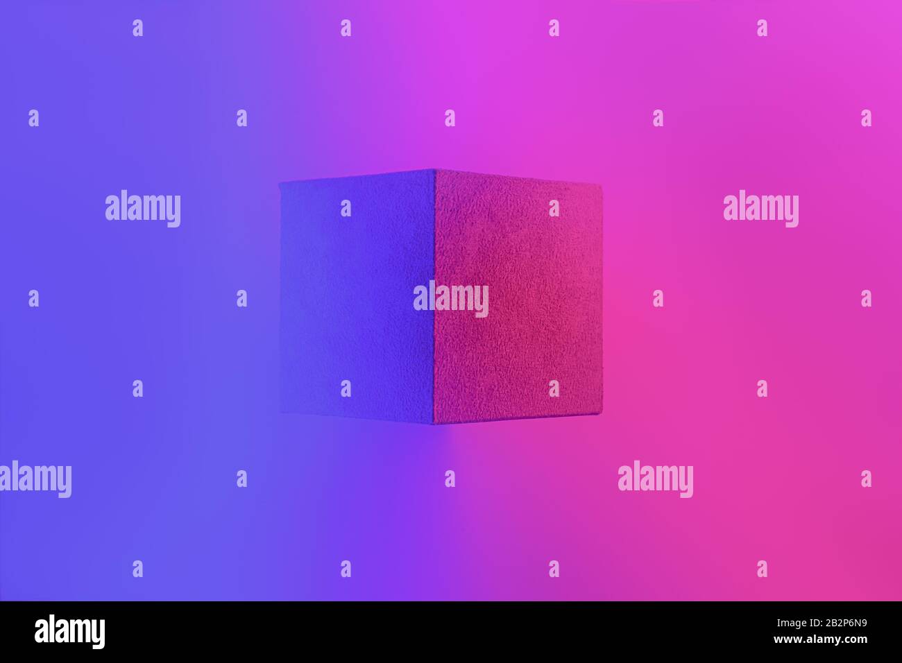 Geometric cube figure in vibrant neon colors. Faded blue and pink ...