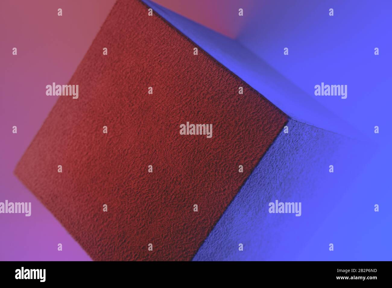 Geometric cube figure in vibrant neon colors. Faded blue and pink ...