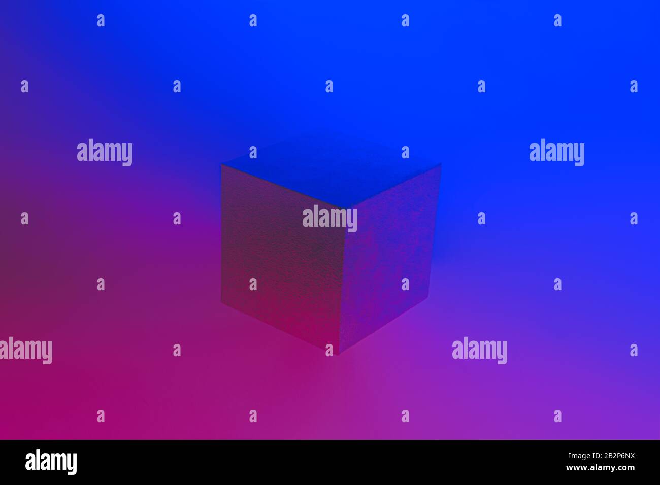 Geometric cube figure in vibrant neon colors. Faded blue and pink ...