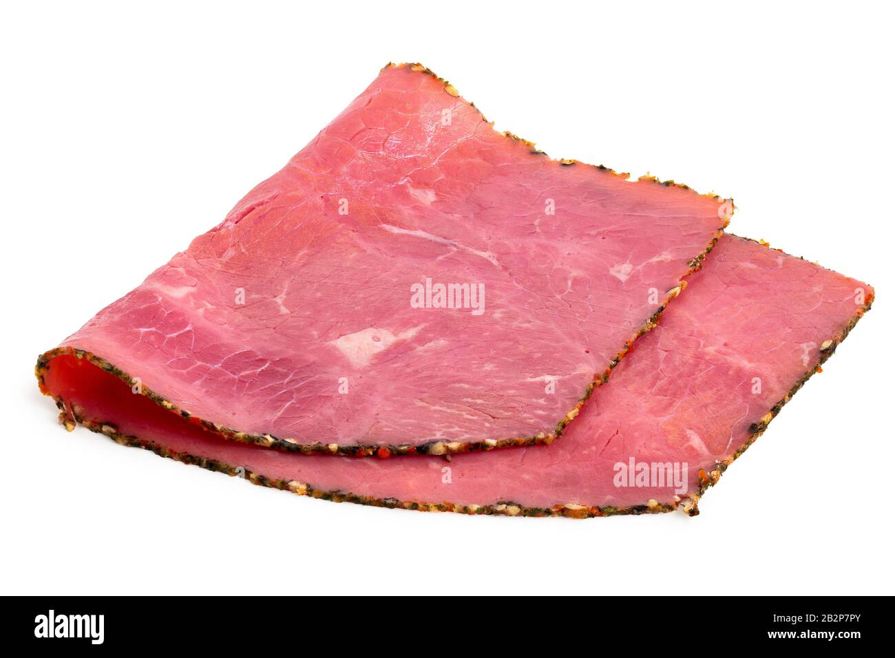A single folded slice of pastrami isolated on white Stock Photo - Alamy