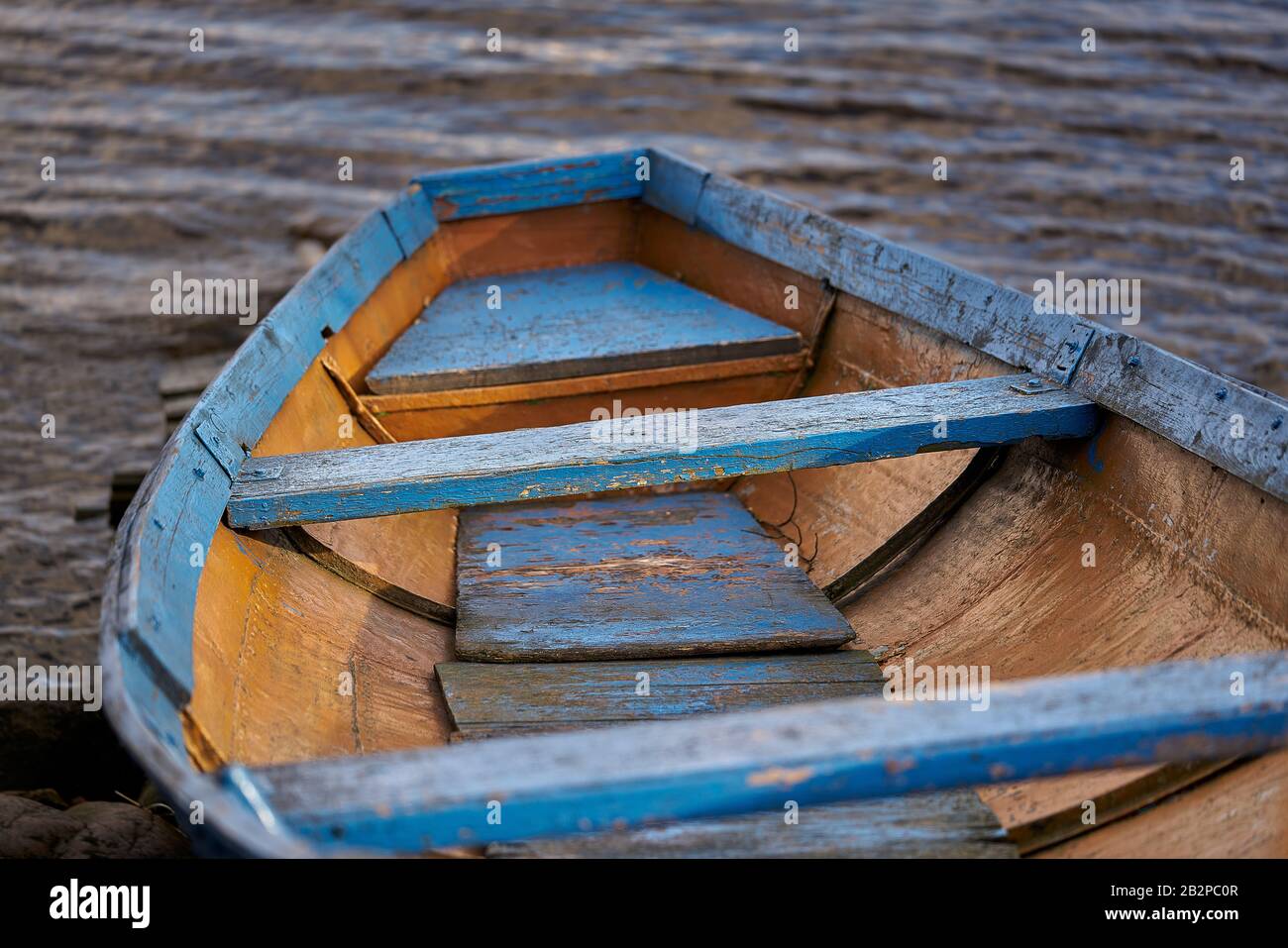Old boat resting on the beach Stock Photo - Alamy