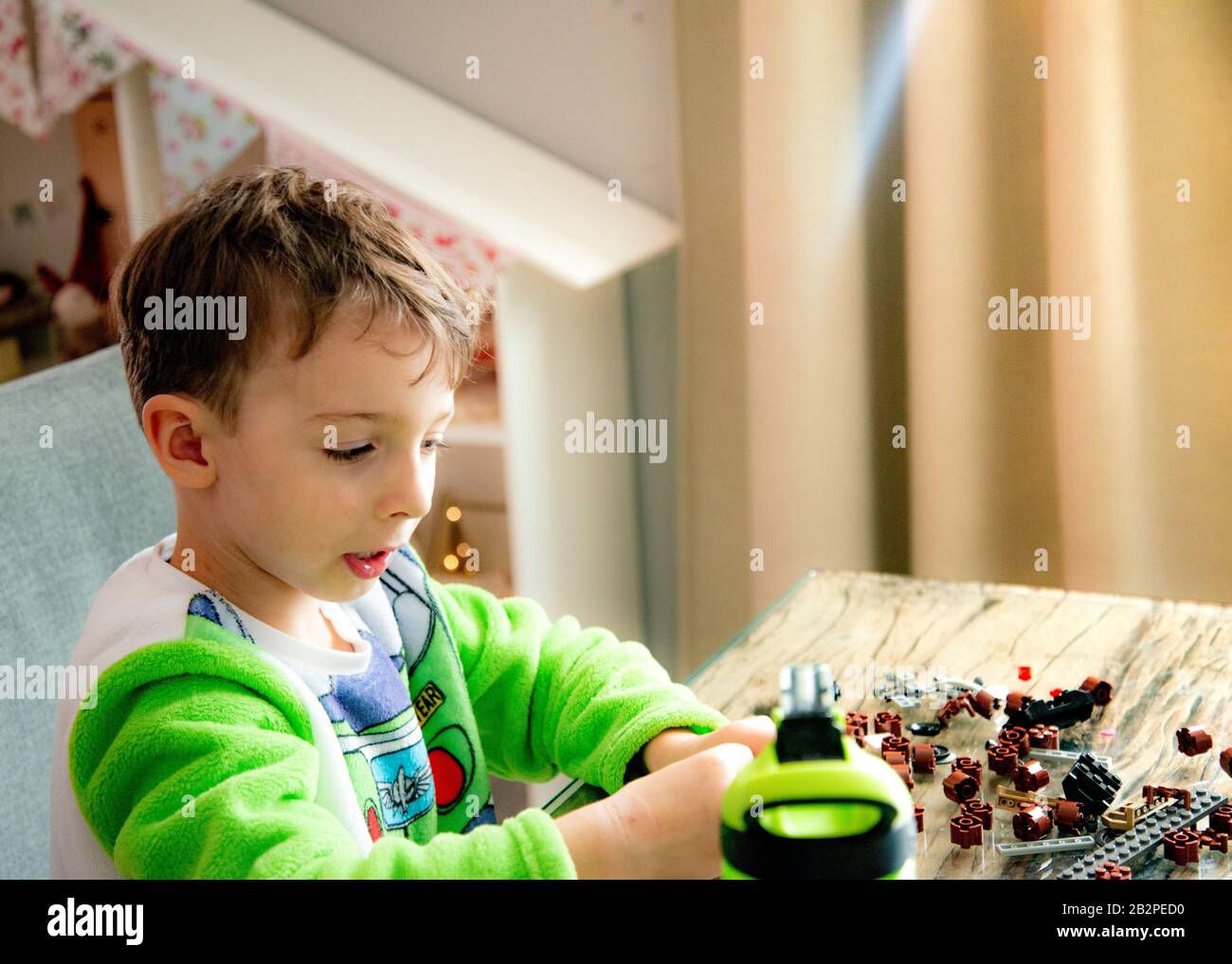 Boy playing with blocks at table hi-res stock photography and images ...