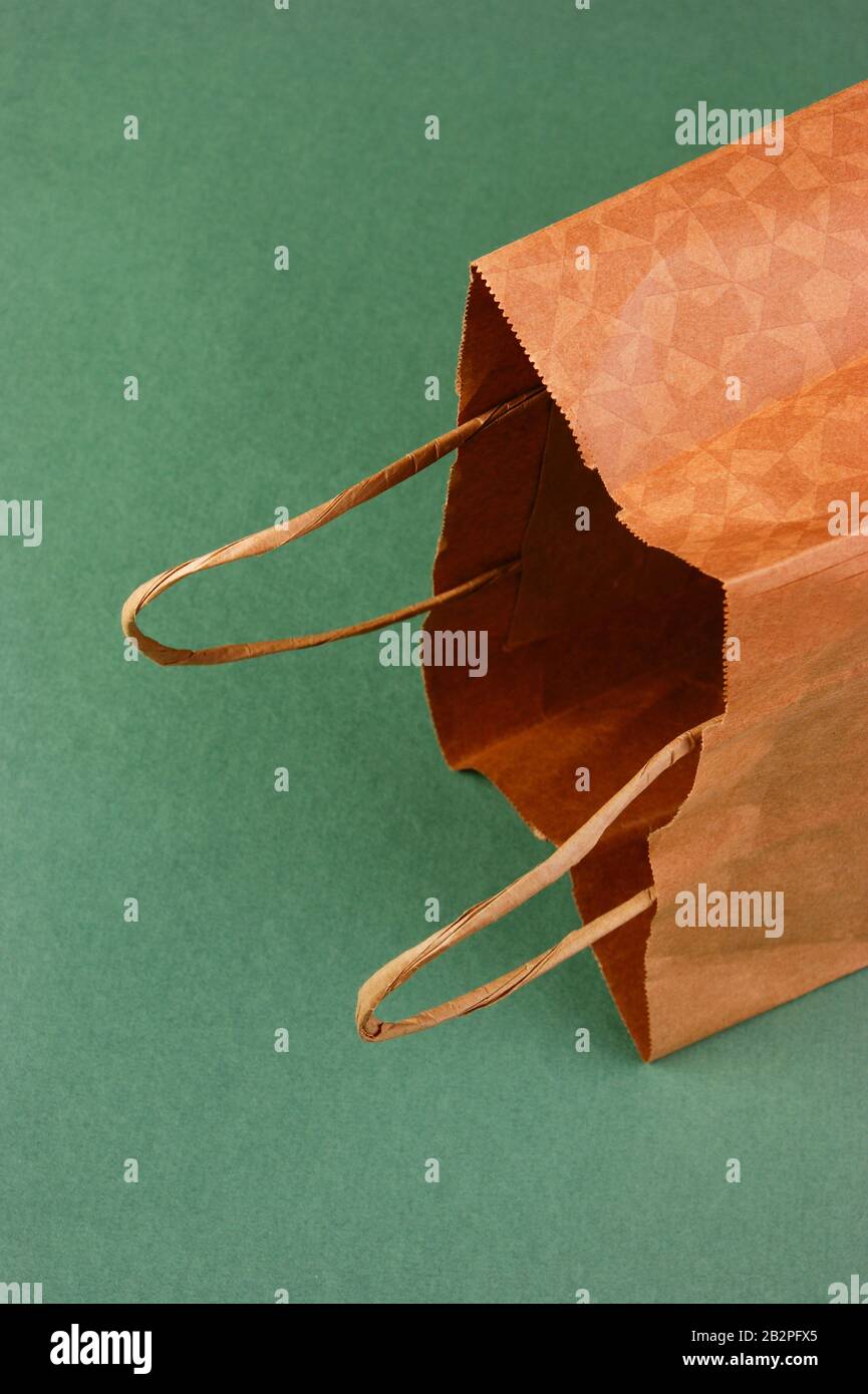 paper bag on a green background Stock Photo - Alamy