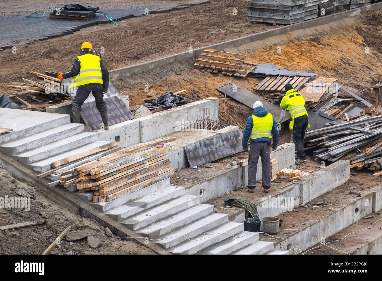 Builders working on construction foundation. Man strengthen concrete ...