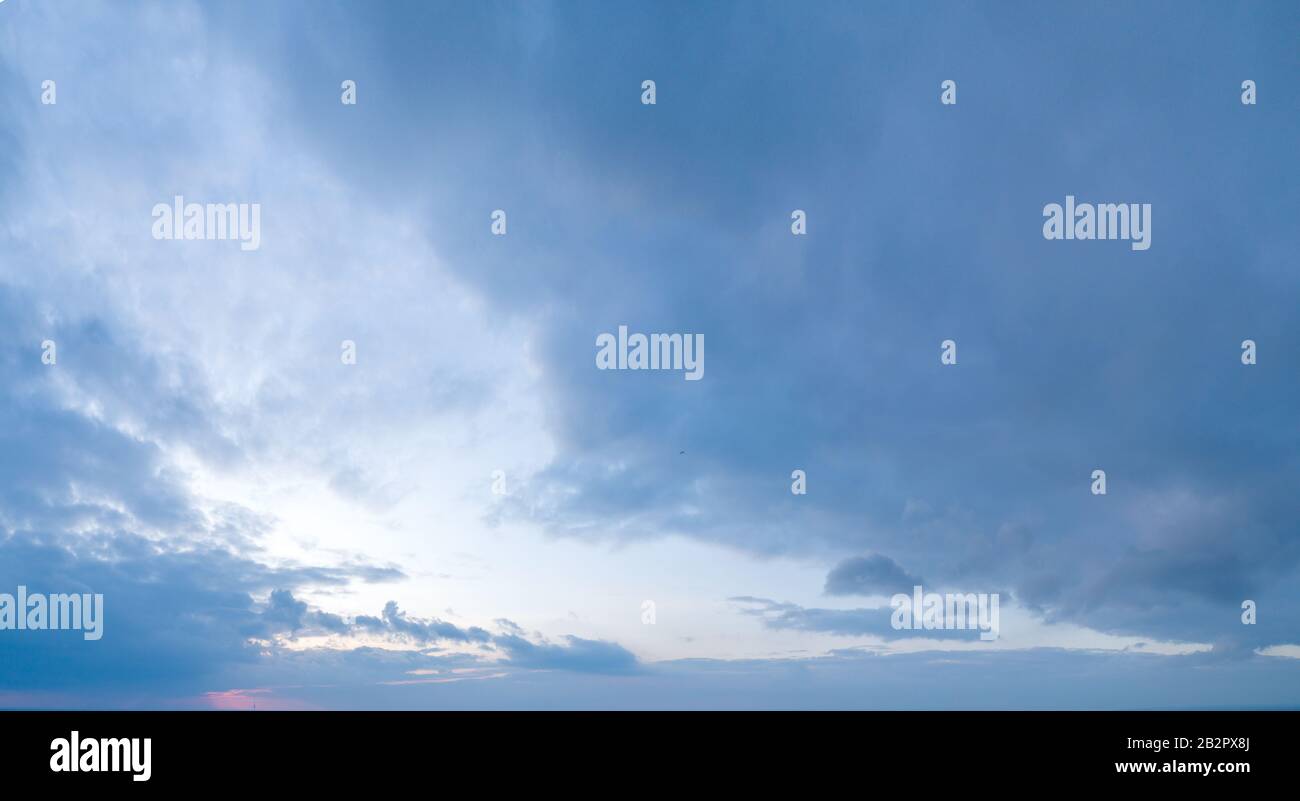 Beautiful sky with stretched clouds during twilight Stock Photo - Alamy