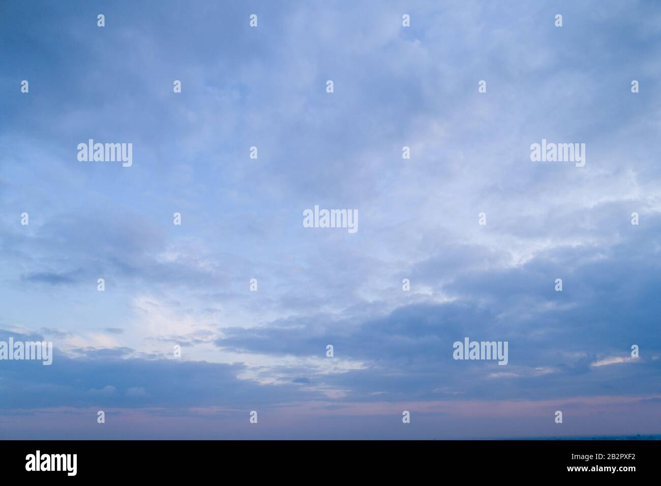 Beautiful sky with stretched clouds during twilight Stock Photo - Alamy