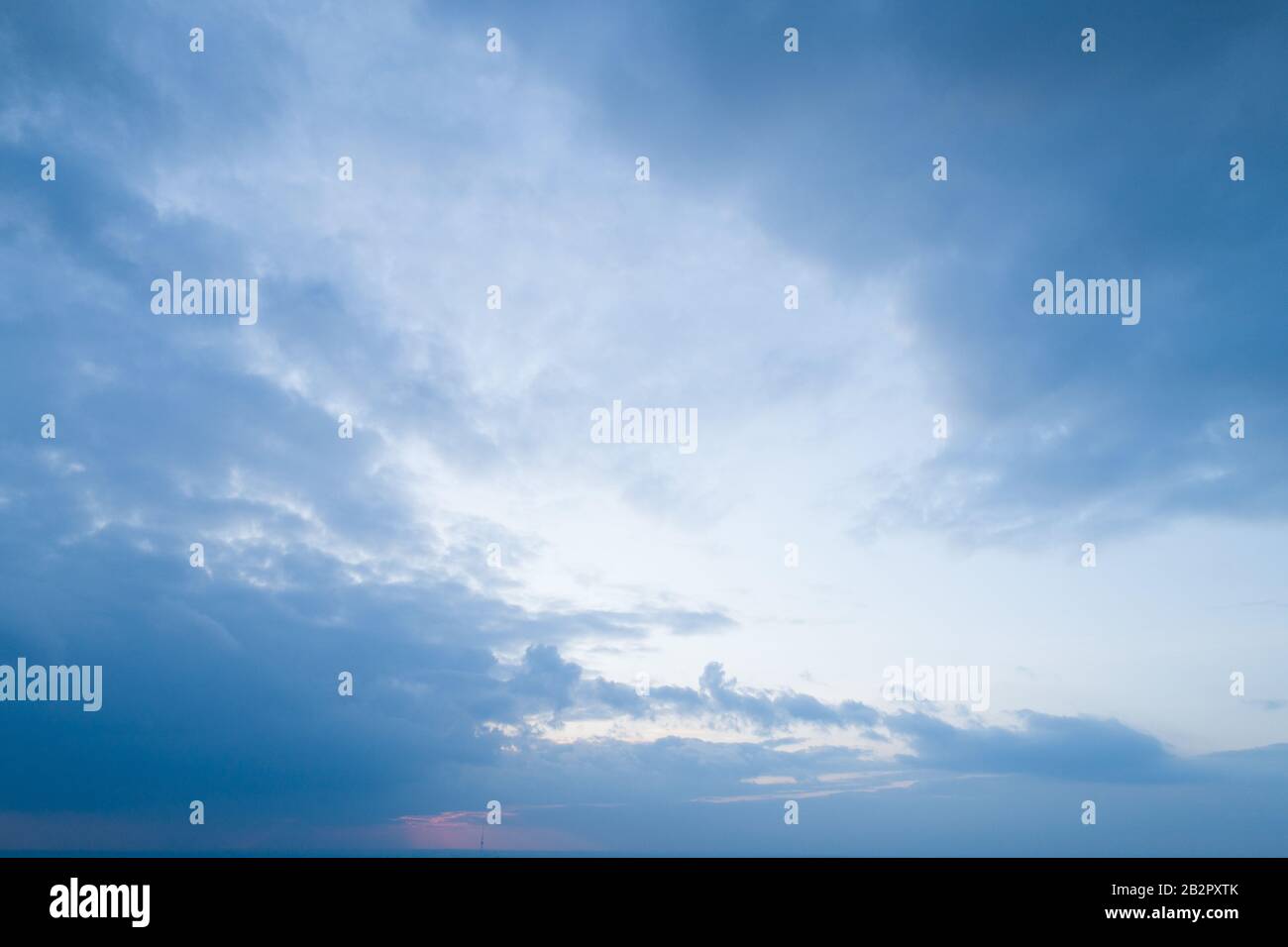 Beautiful sky with stretched clouds during twilight Stock Photo - Alamy